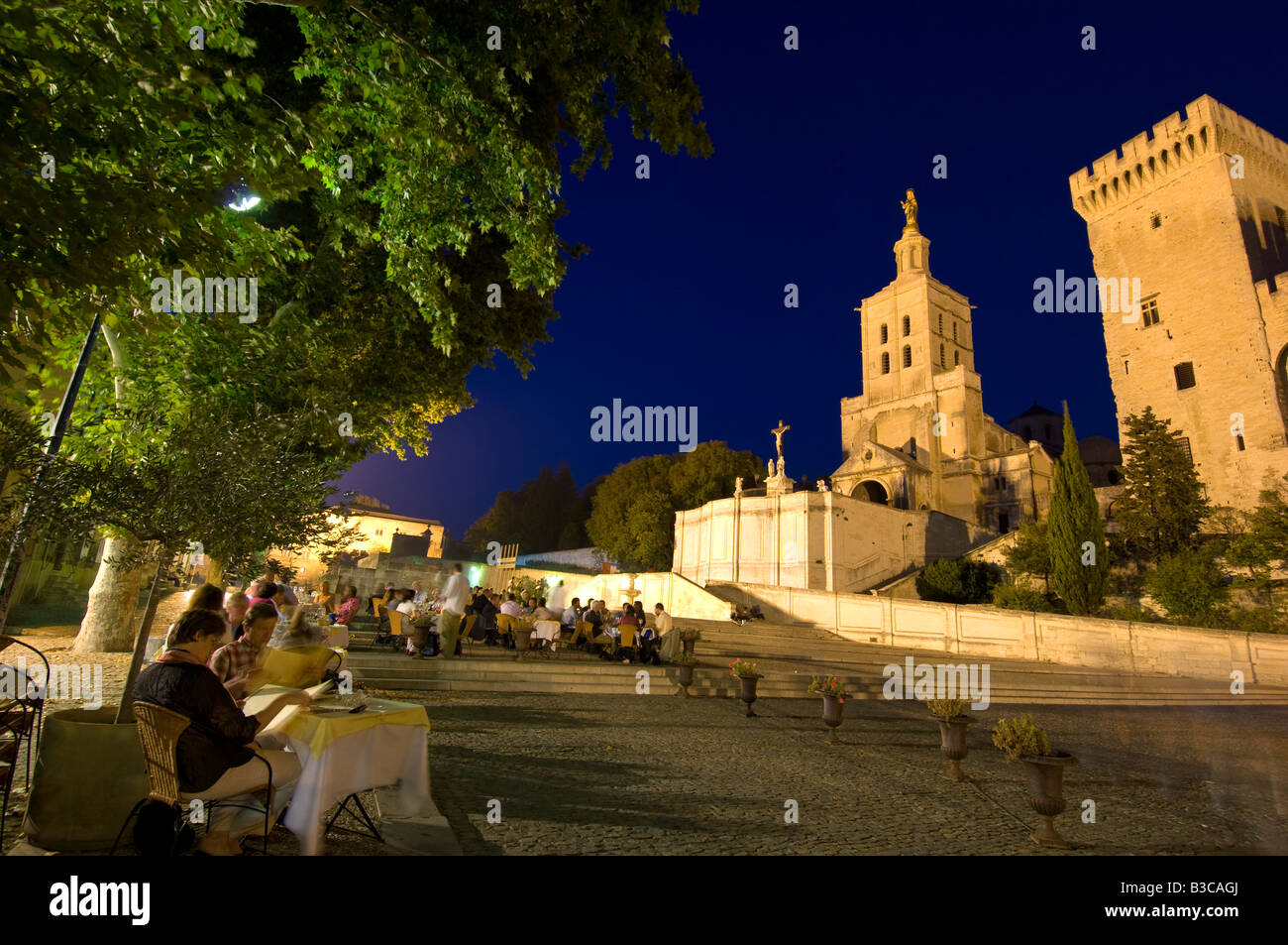 Europe France Provence Avignon dining alfresco at night by Palais des ...