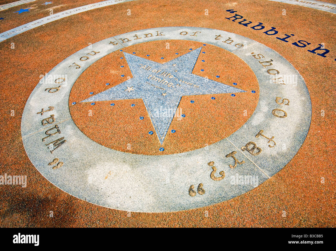Inscribed showbiz star with quotes at the Eric Morecambe bronze statue ...