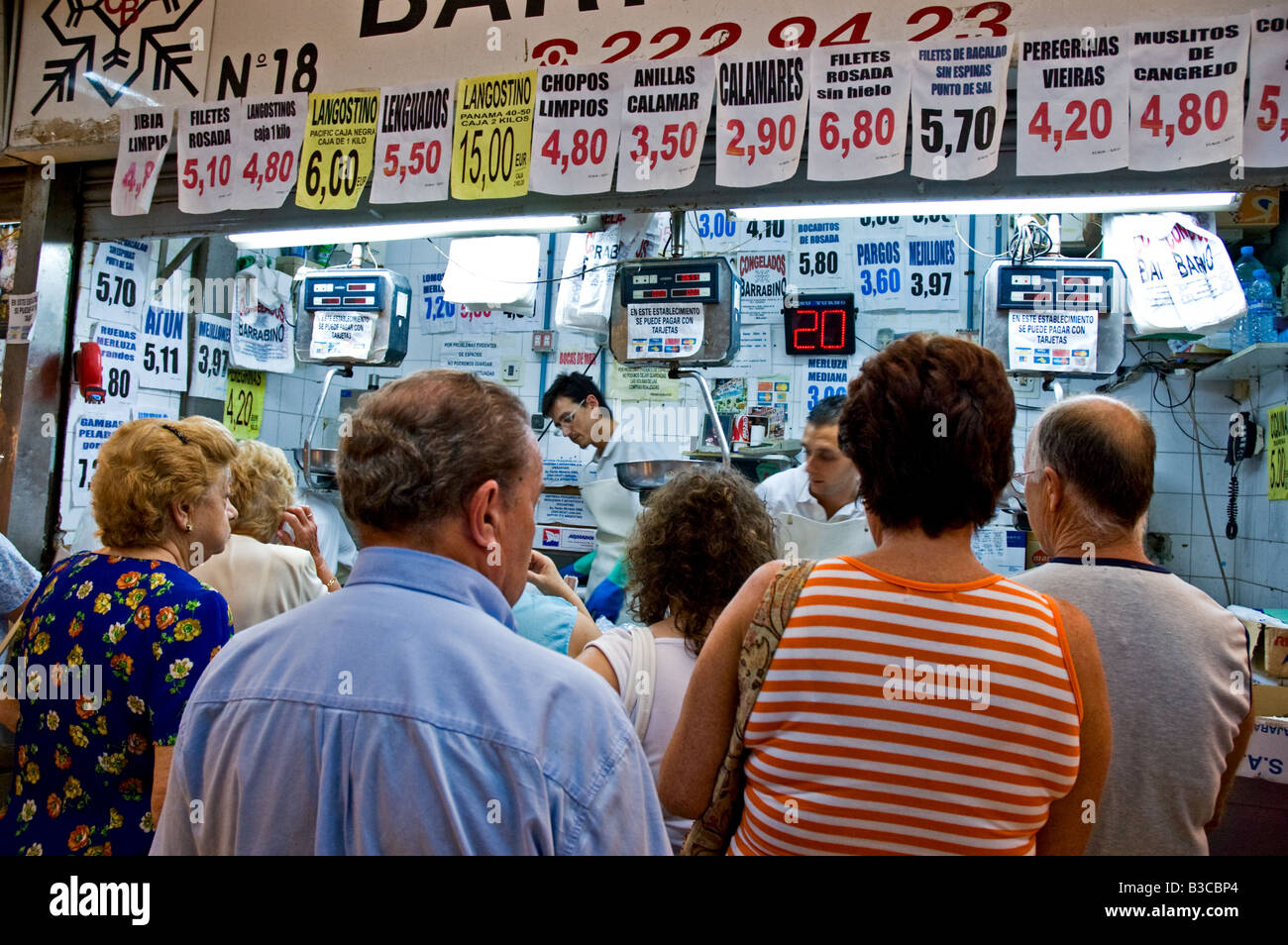 A busy market stall in the central market with cards displaying the ...