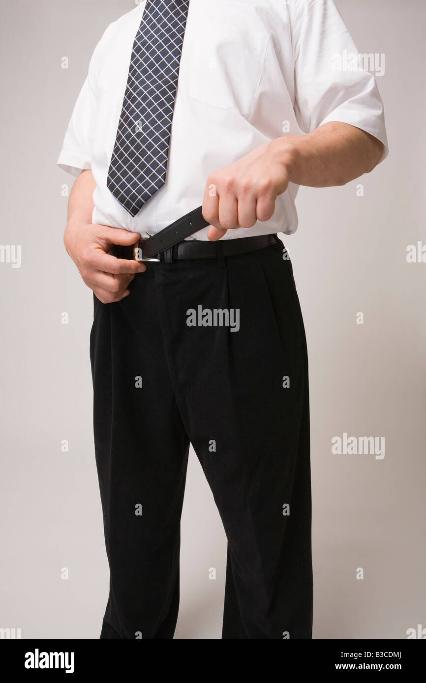 Man tightening his tie hi-res stock photography and images - Alamy