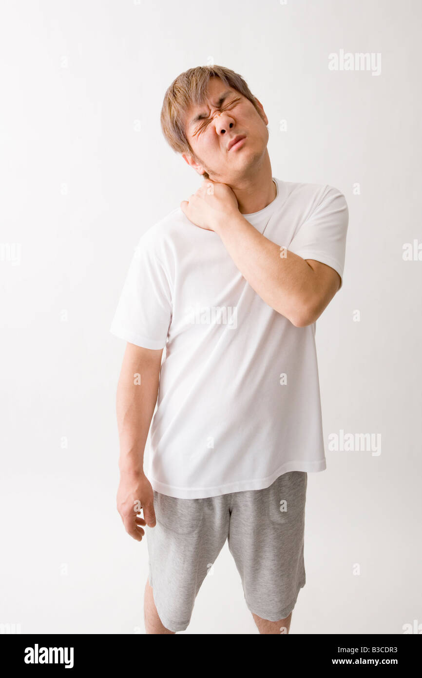 Mid adult man suffering from pain Stock Photo - Alamy