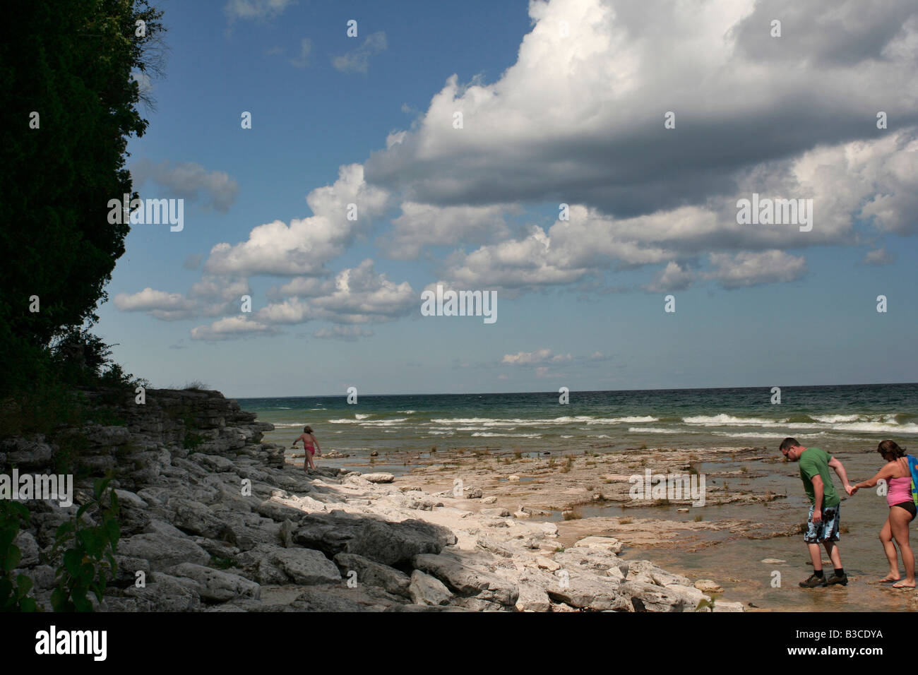 Family enjoying rocky west coast of Lake Michigan in Wisconsin Stock ...