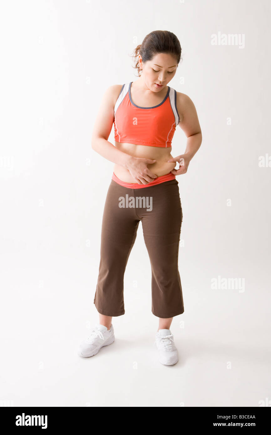 Pinching waist hi-res stock photography and images - Alamy