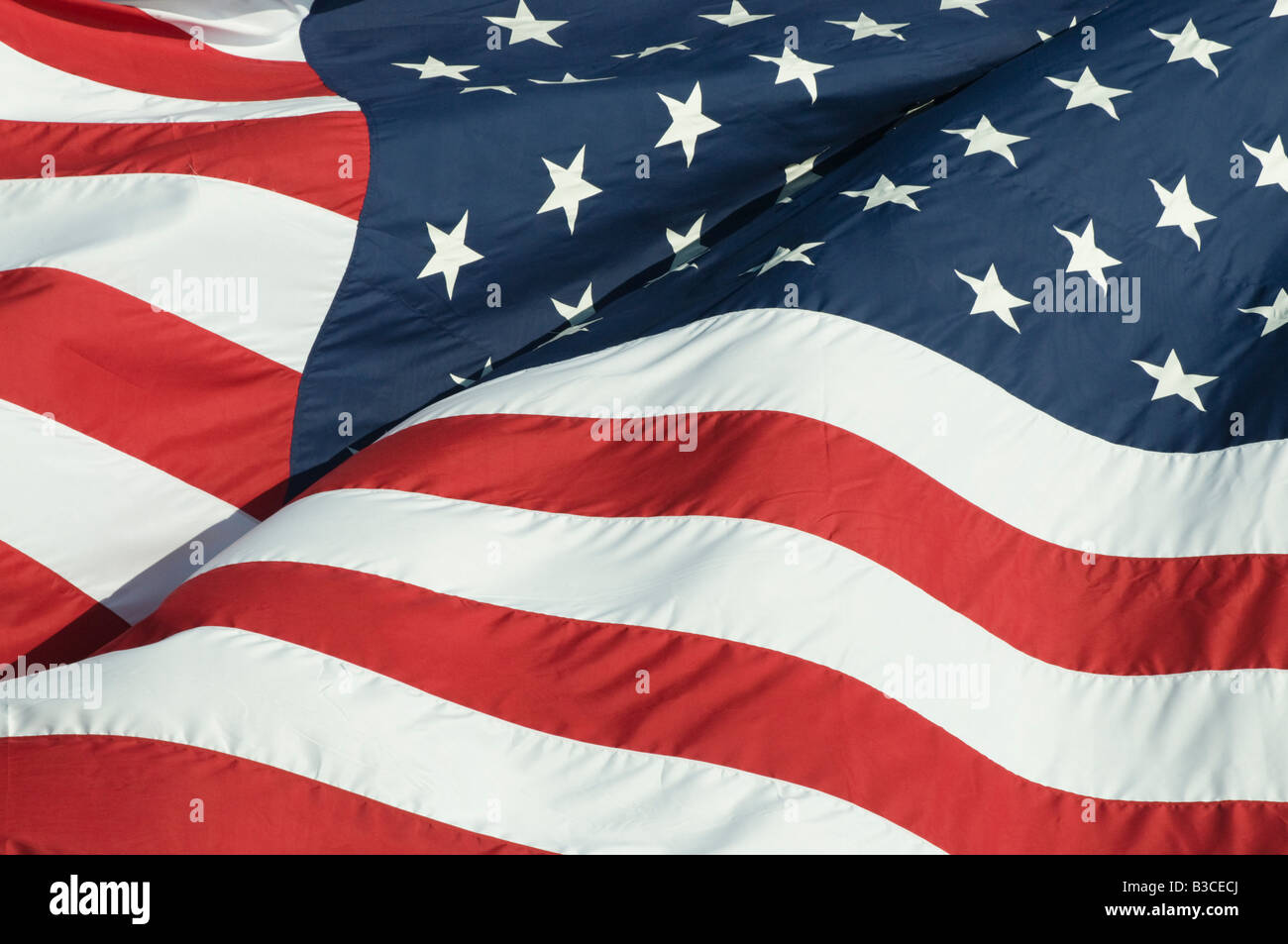 American Flag blowing in the wind Stock Photo - Alamy
