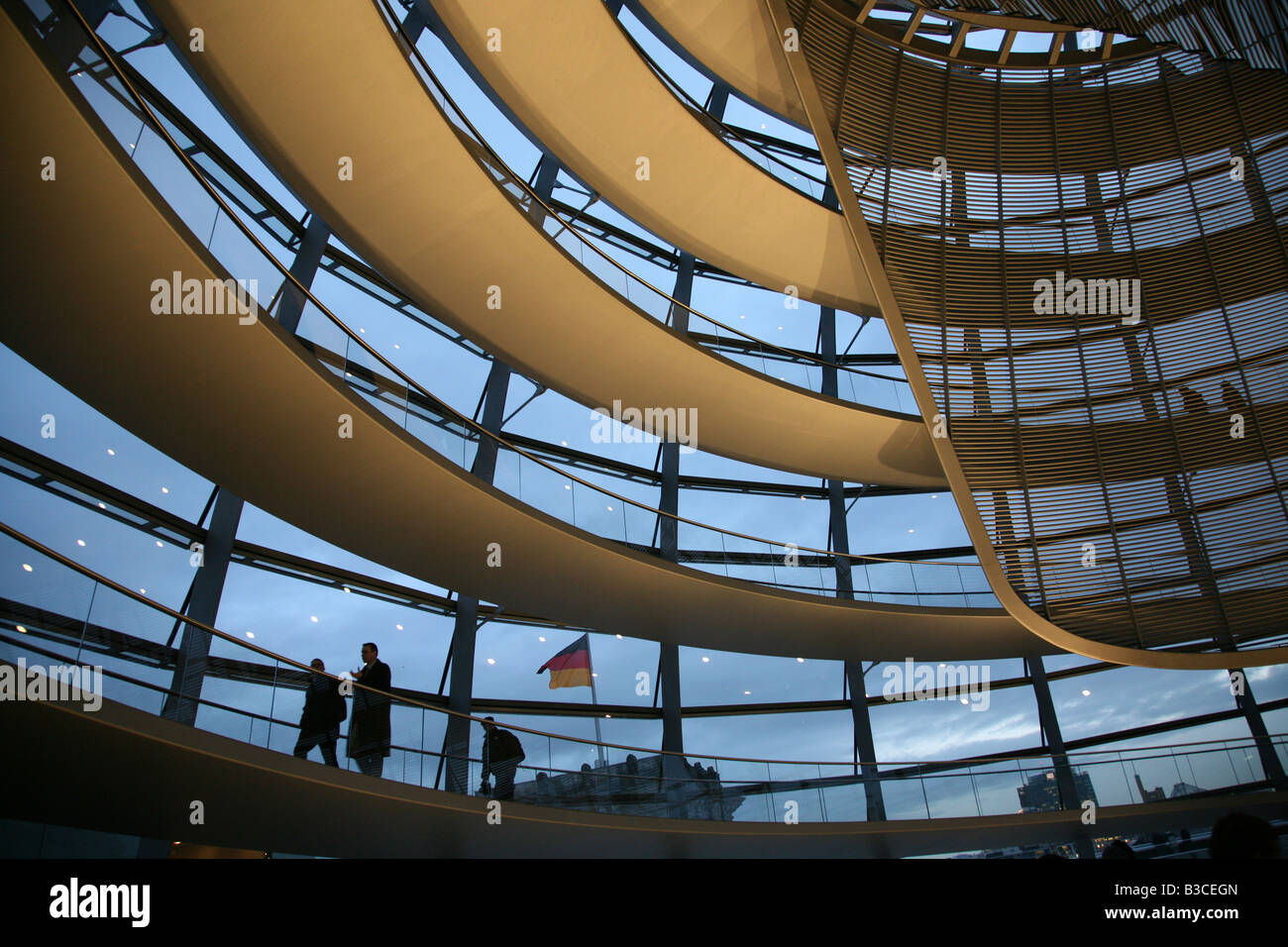 Tourists inside the dome of the Reichstag building in Berlin, Germany ...