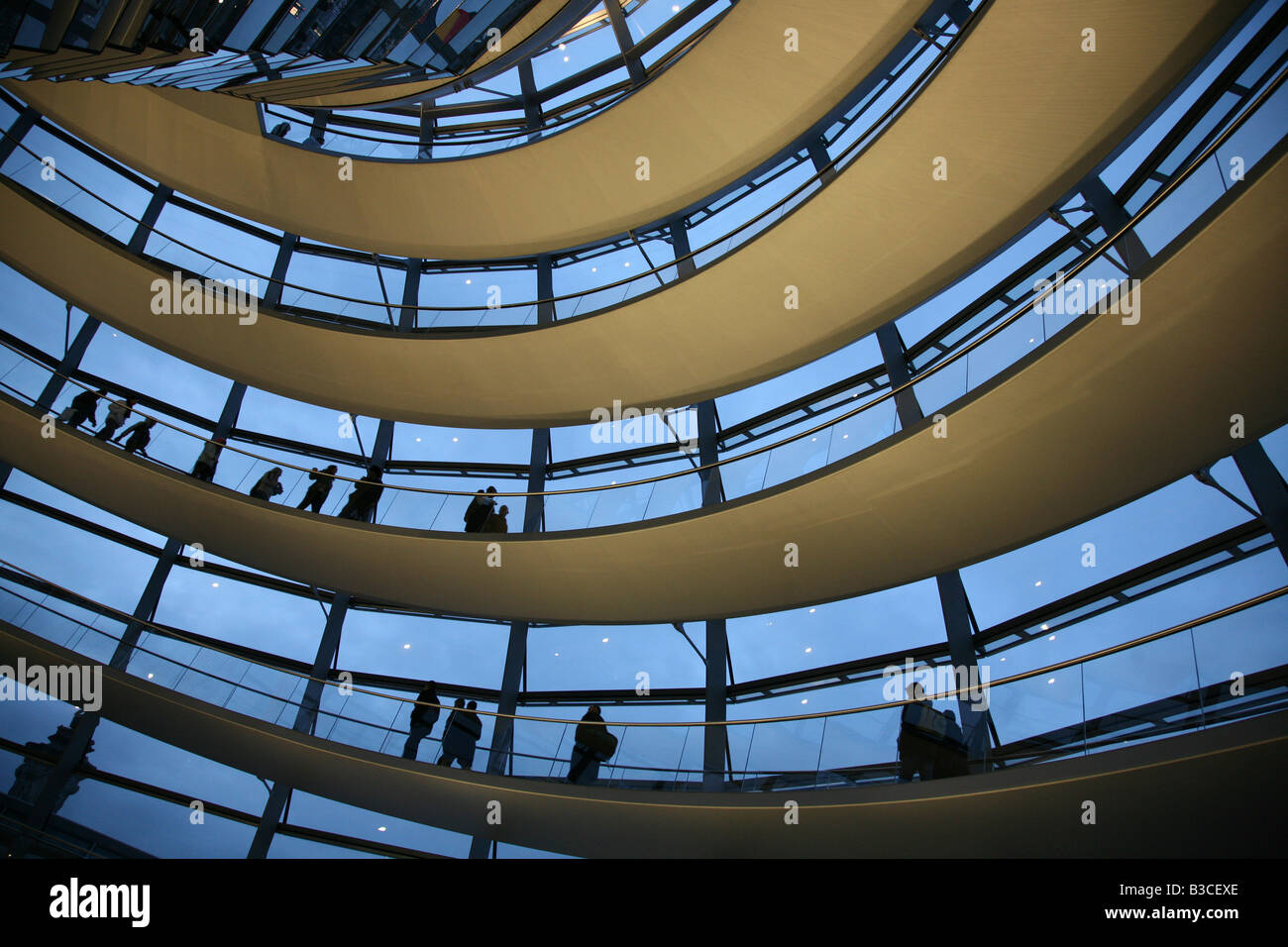 Tourists inside the dome of the Reichstag building in Berlin, Germany ...