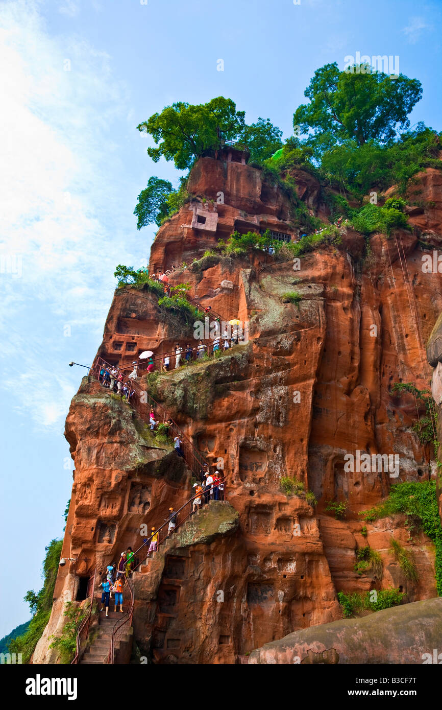 People descending Nine Turns Staircase cliff face steps viewing the ...