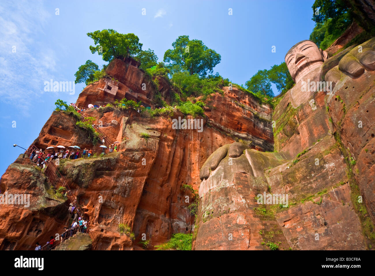 People descending Nine Turns Staircase cliff face steps viewing the ...