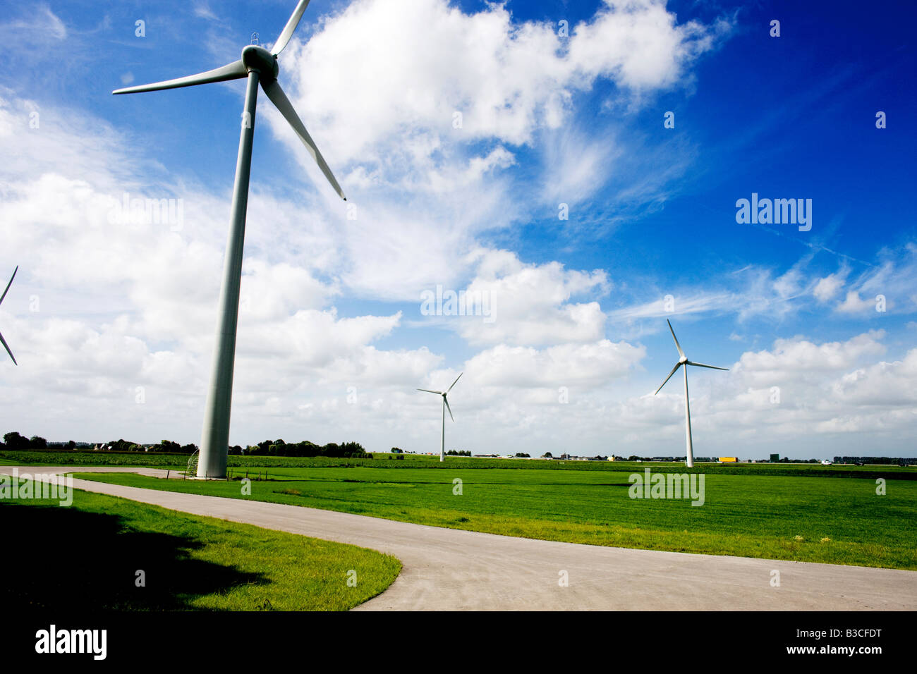 row of wind turbines in a field Stock Photo - Alamy