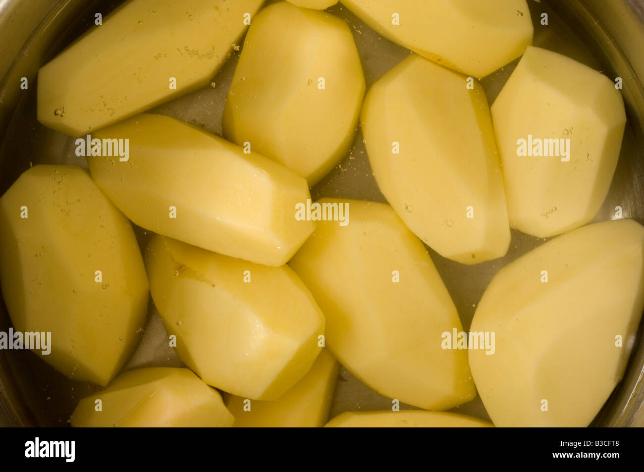 Peeled potatoes in water close hi-res stock photography and images - Alamy