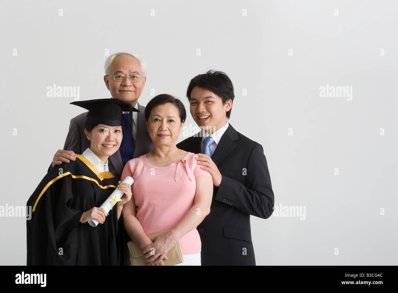 Parents standing with their graduate son hi-res stock photography and ...