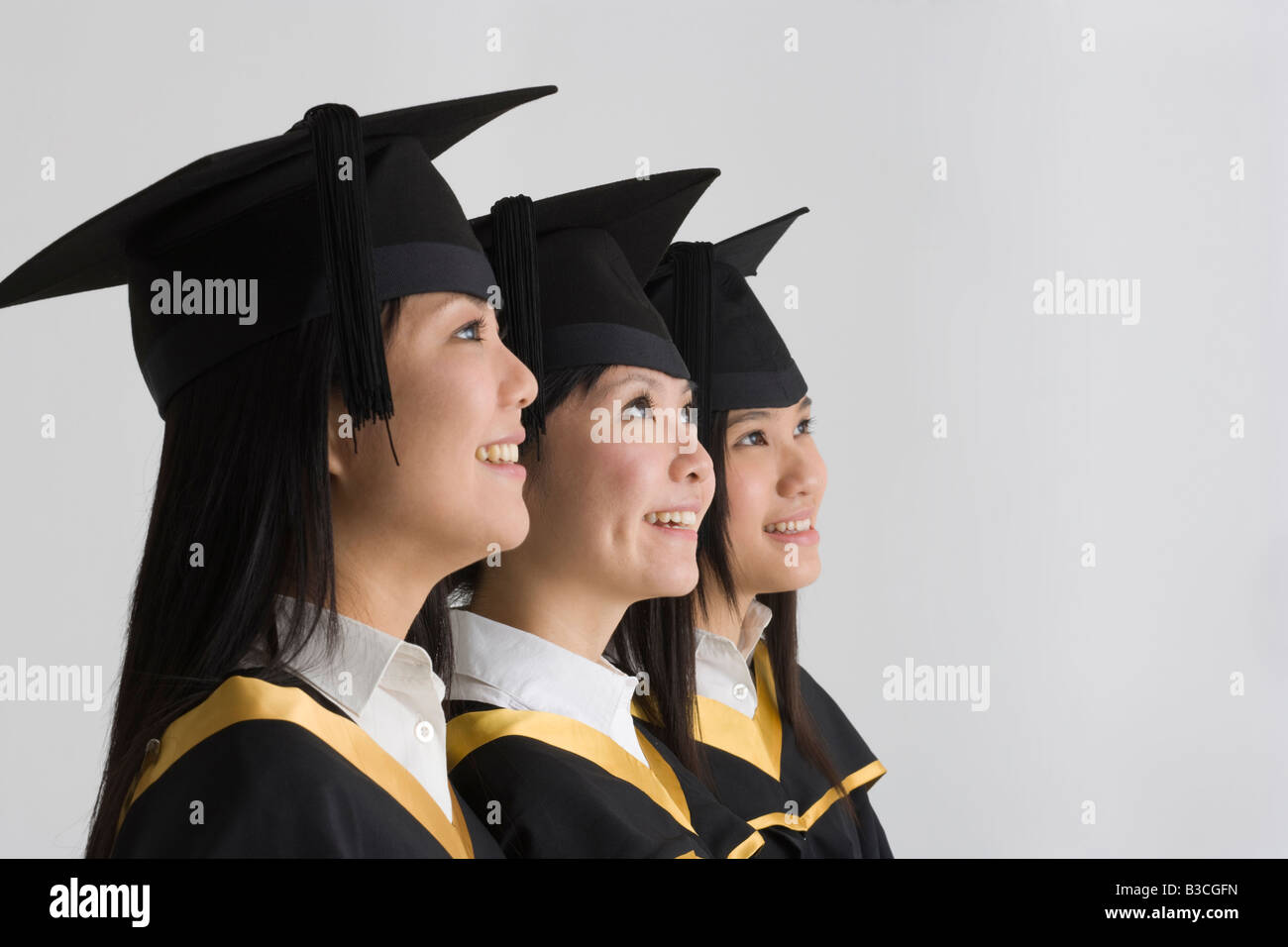 Side profile of three female graduate students smiling Stock Photo - Alamy