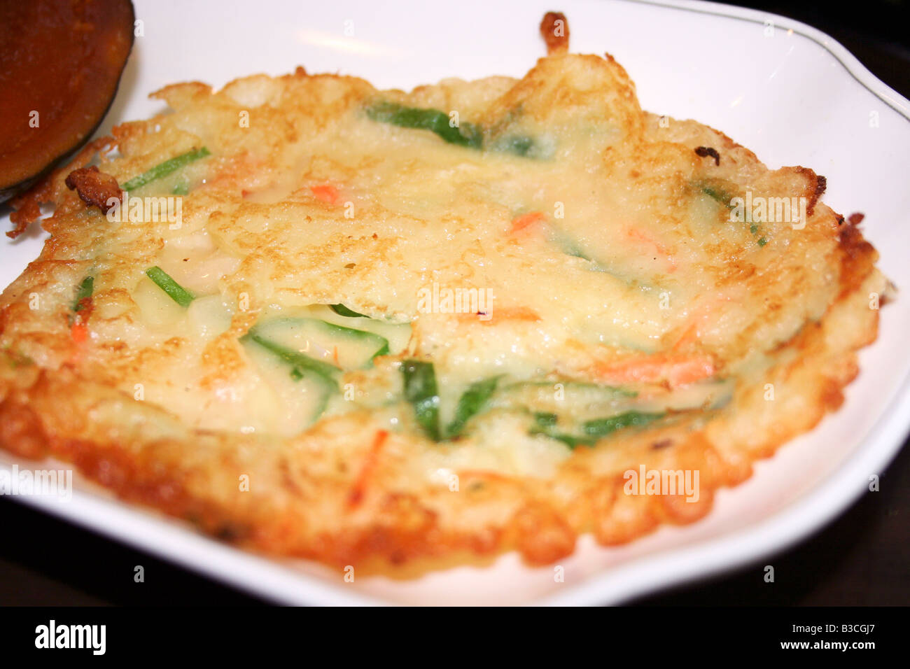 Pan fried korean pie with various veggetables inside Stock Photo - Alamy