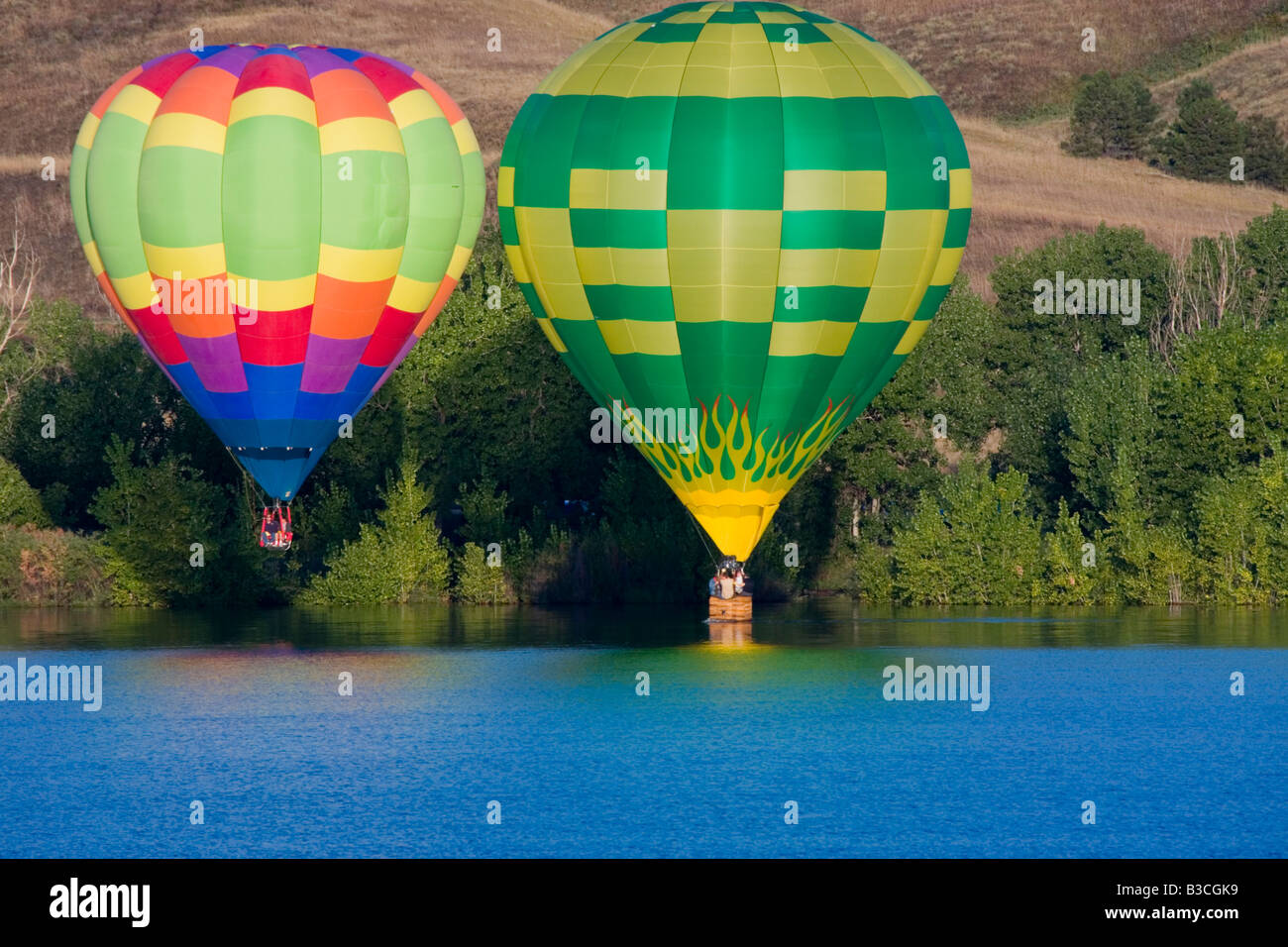 Boats and spectators enjoy a mass ascension of hot air balloons at the ...