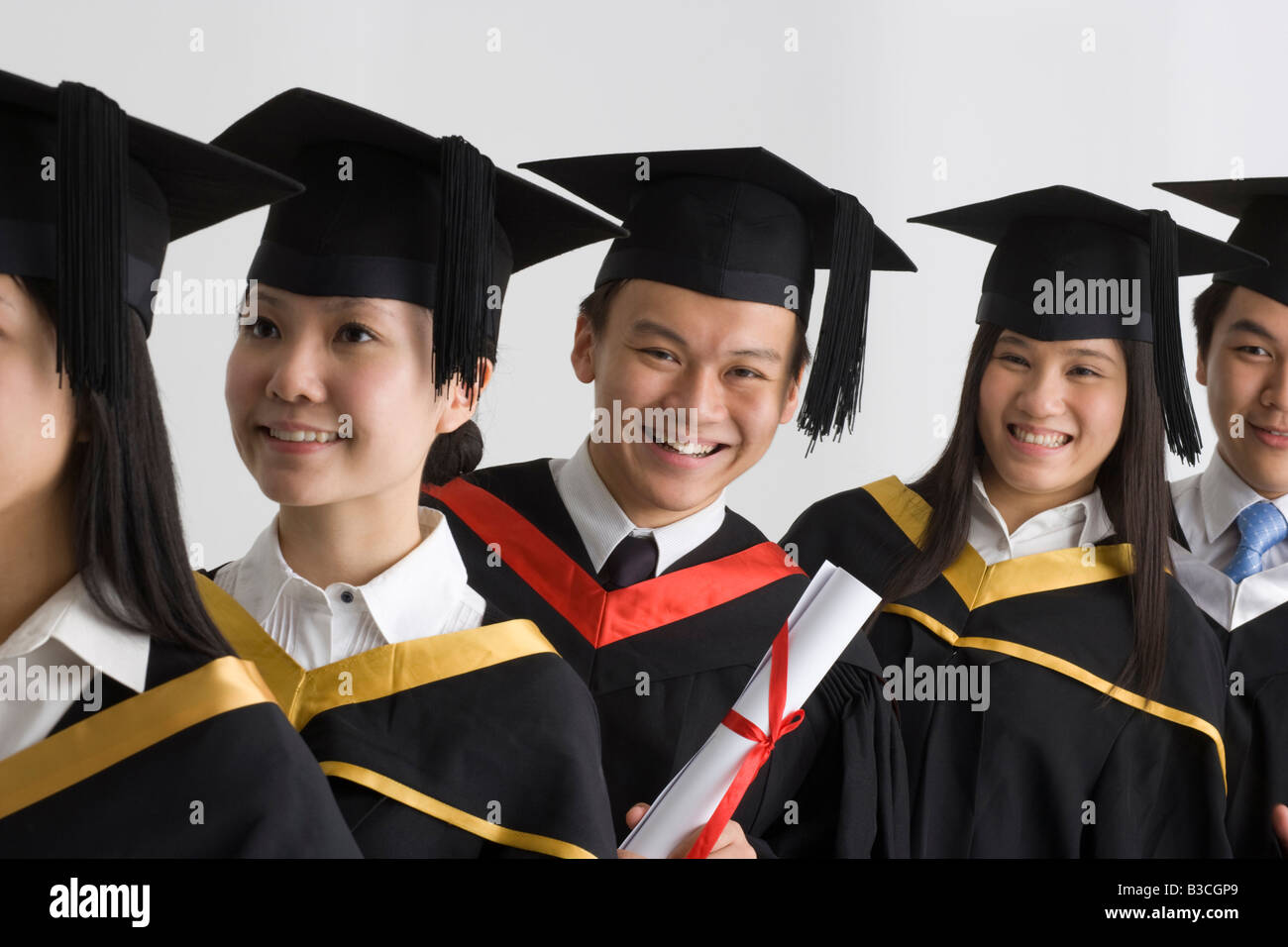 Five young graduate students smiling together in a row Stock Photo - Alamy