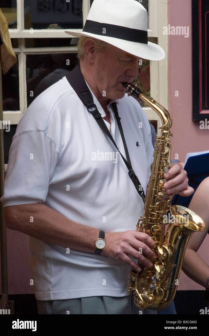 Playing the saxaphone in Church Street, Twickenham Stock Photo - Alamy