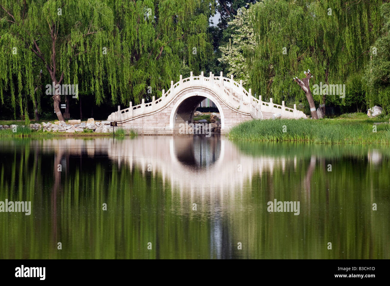 China, Beijing. Old Summer Palace - an arched stone bridge Stock Photo ...