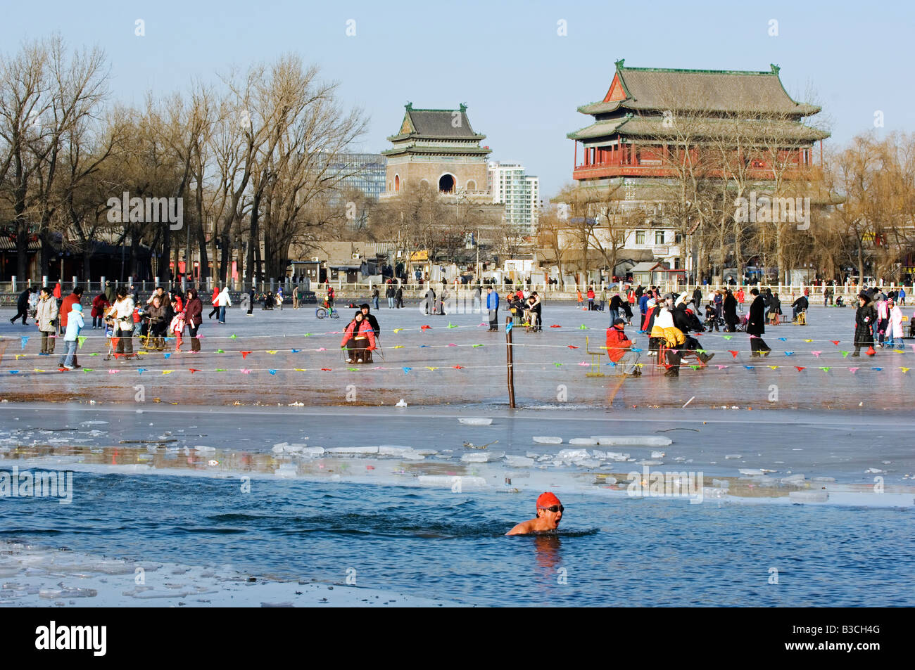 China, Beijing, Houhai area. Winter swimming in front of The Drum and ...
