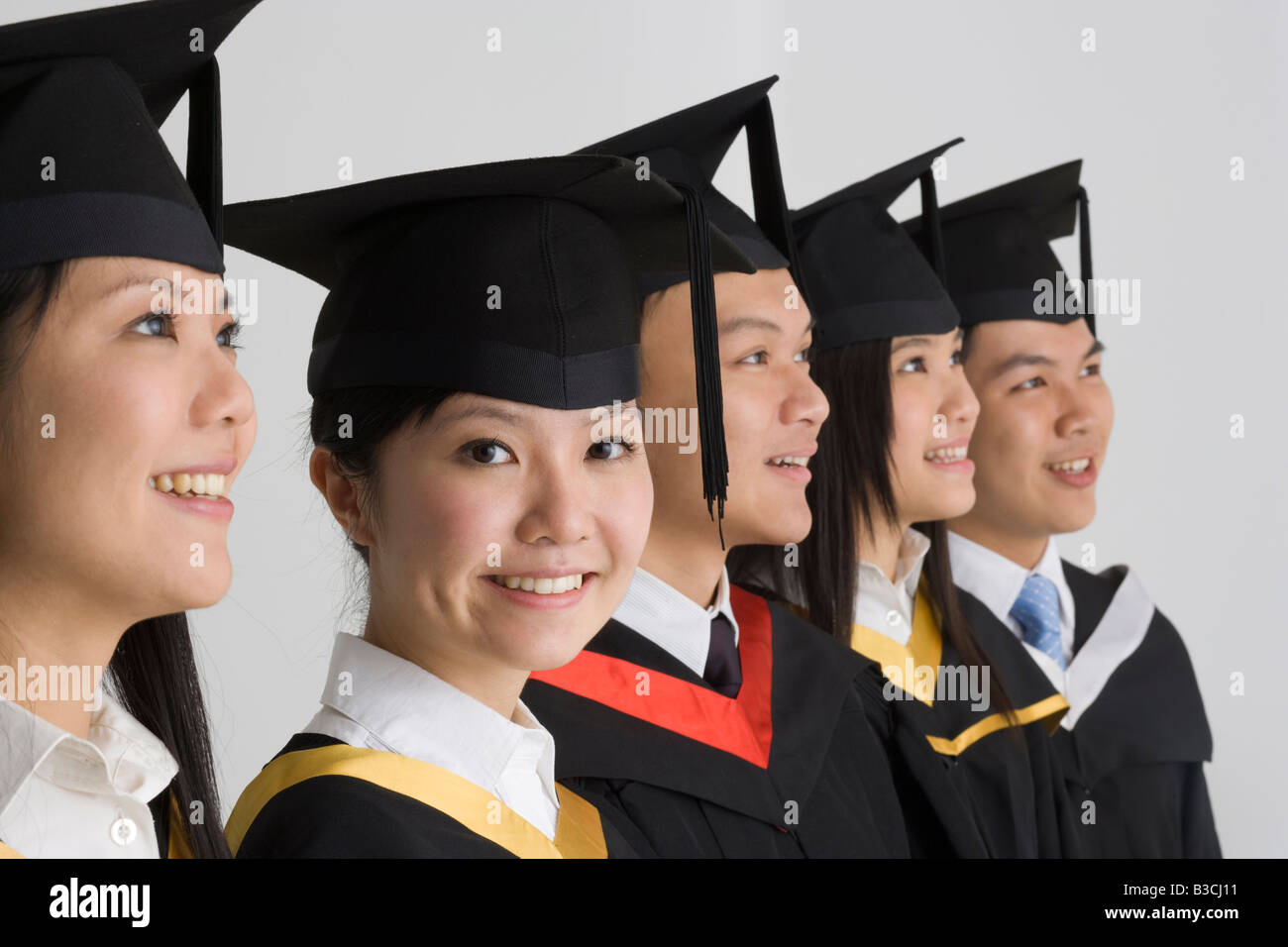 Five young graduate students smiling together Stock Photo - Alamy