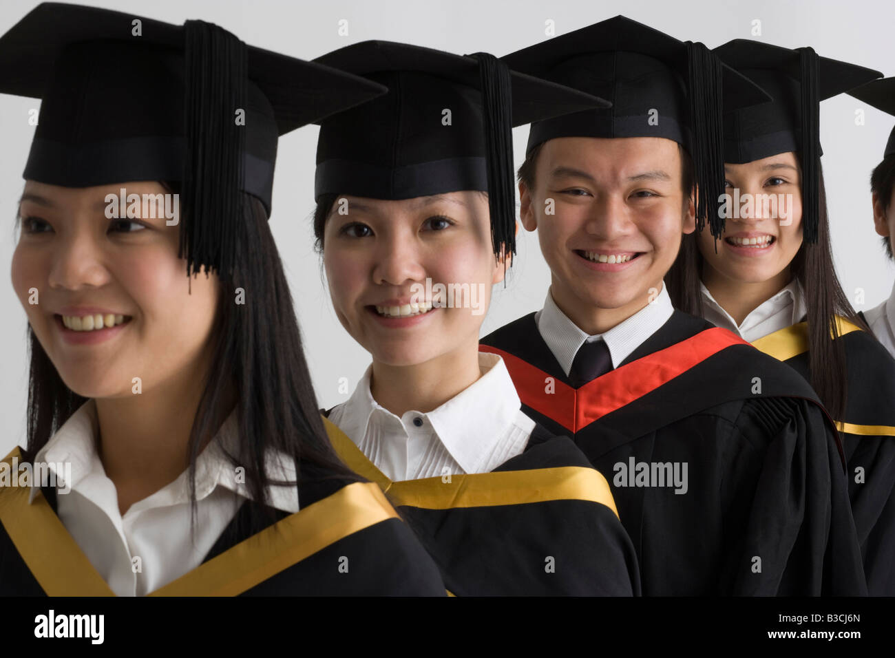 Young graduate students smiling together Stock Photo - Alamy
