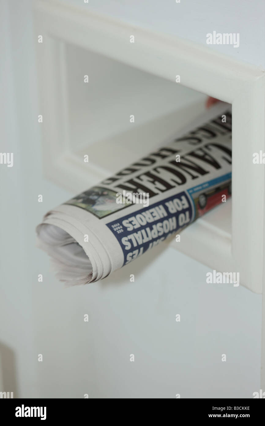 Newspaper Through Letterbox Stock Photo - Alamy
