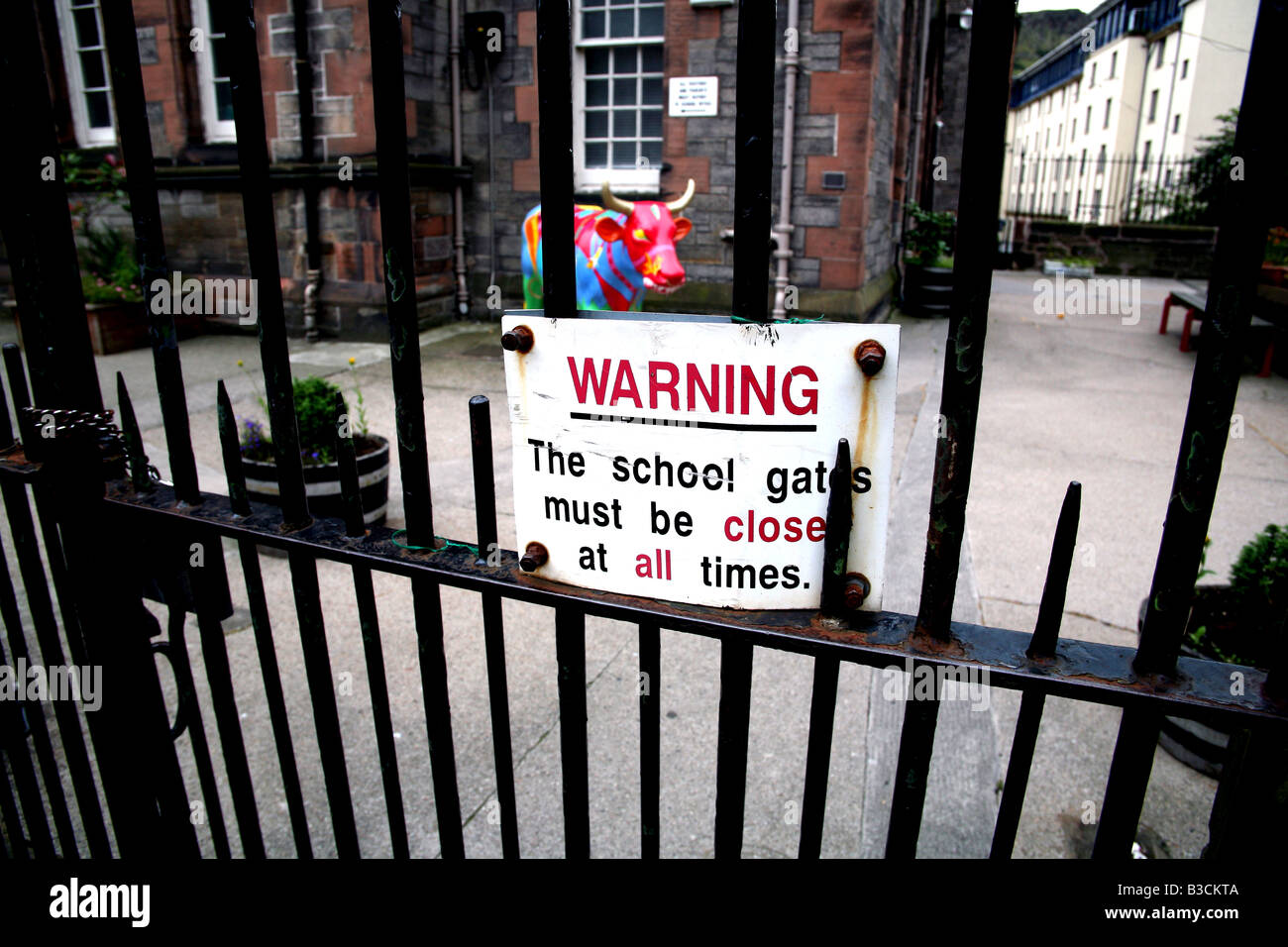 Security sign on school gates, Edinburgh Stock Photo - Alamy