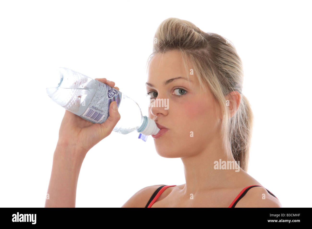 Young Woman Drinking From A Bottle Of Water Model Released Stock Photo ...