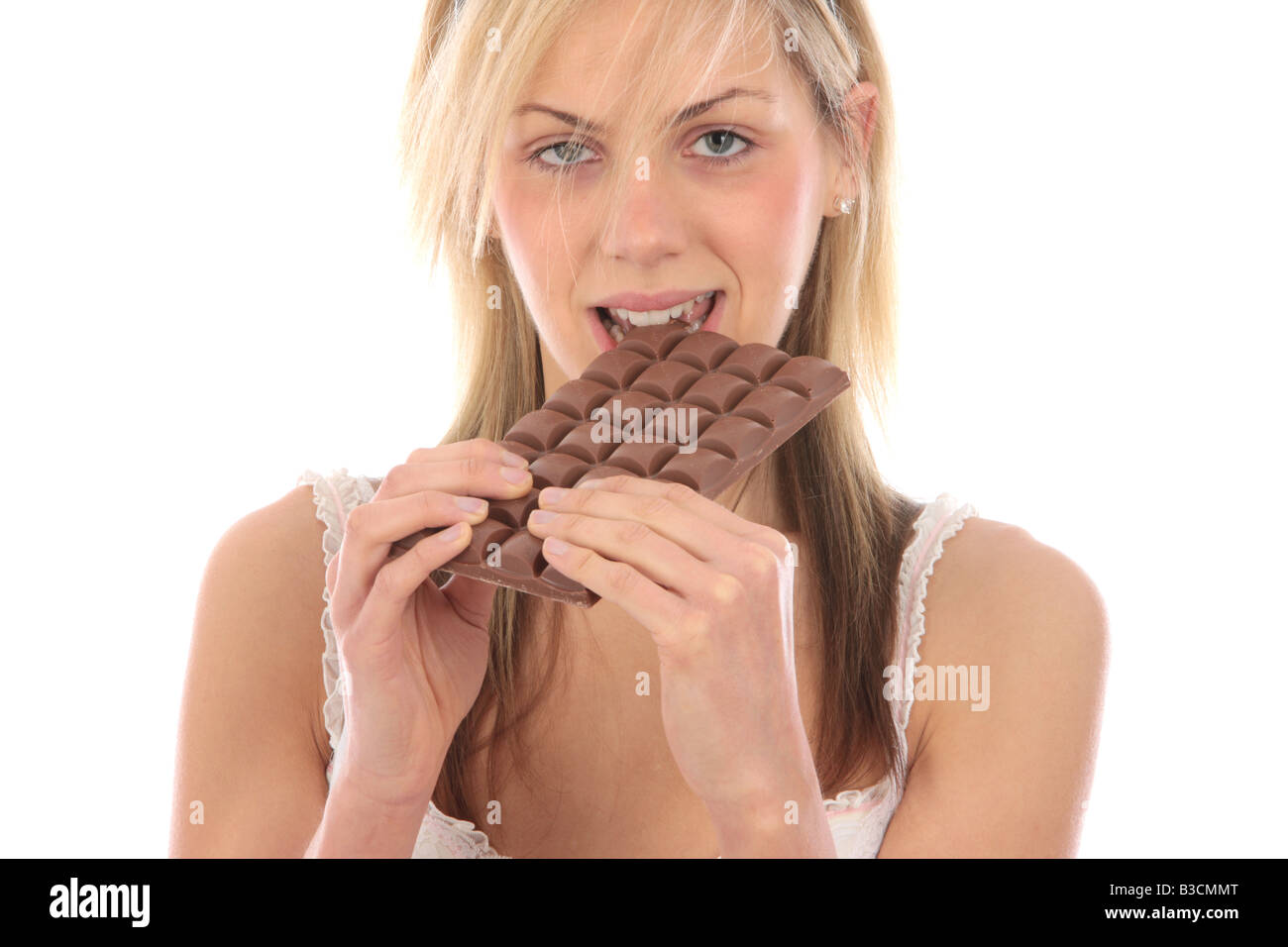 Young Woman Eating Bar of Chocolate Model Released Stock Photo - Alamy
