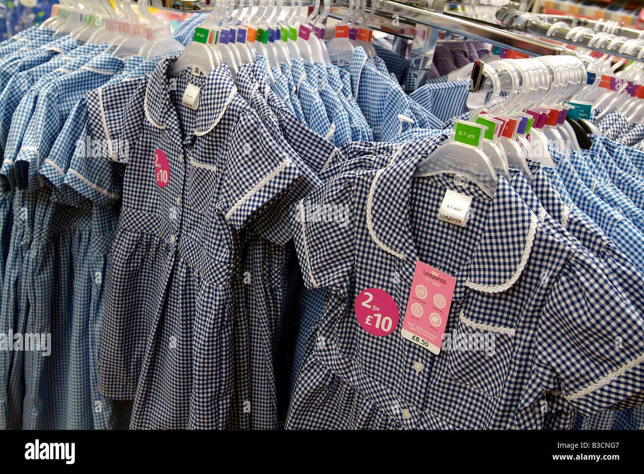 Schoolwear on display in clothing store Stock Photo - Alamy