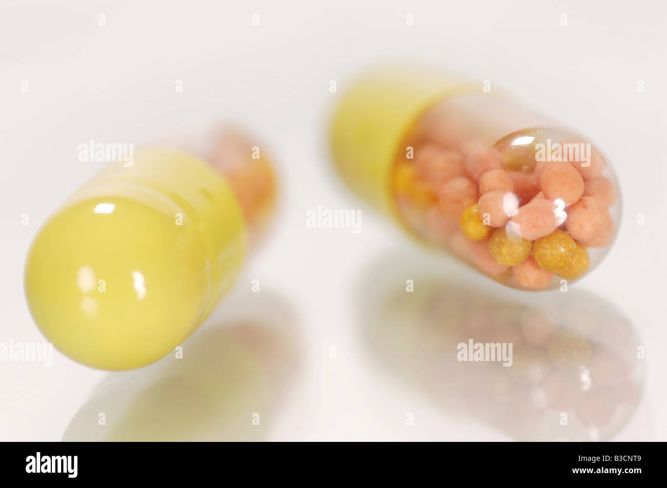 Two capsules, close-up Stock Photo - Alamy
