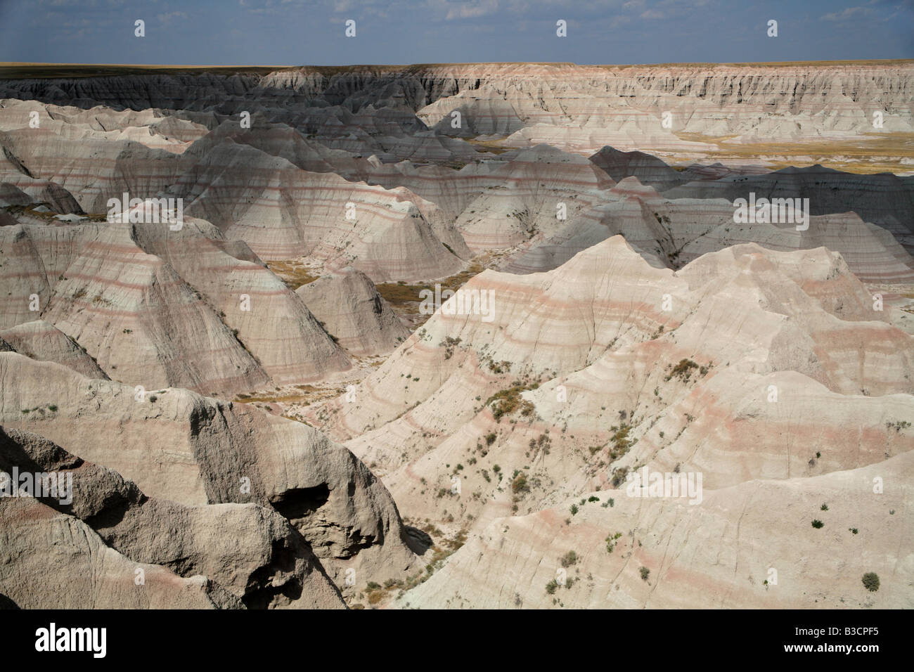 A view of The Badlands South Dakota in summer showing a stark landscape ...