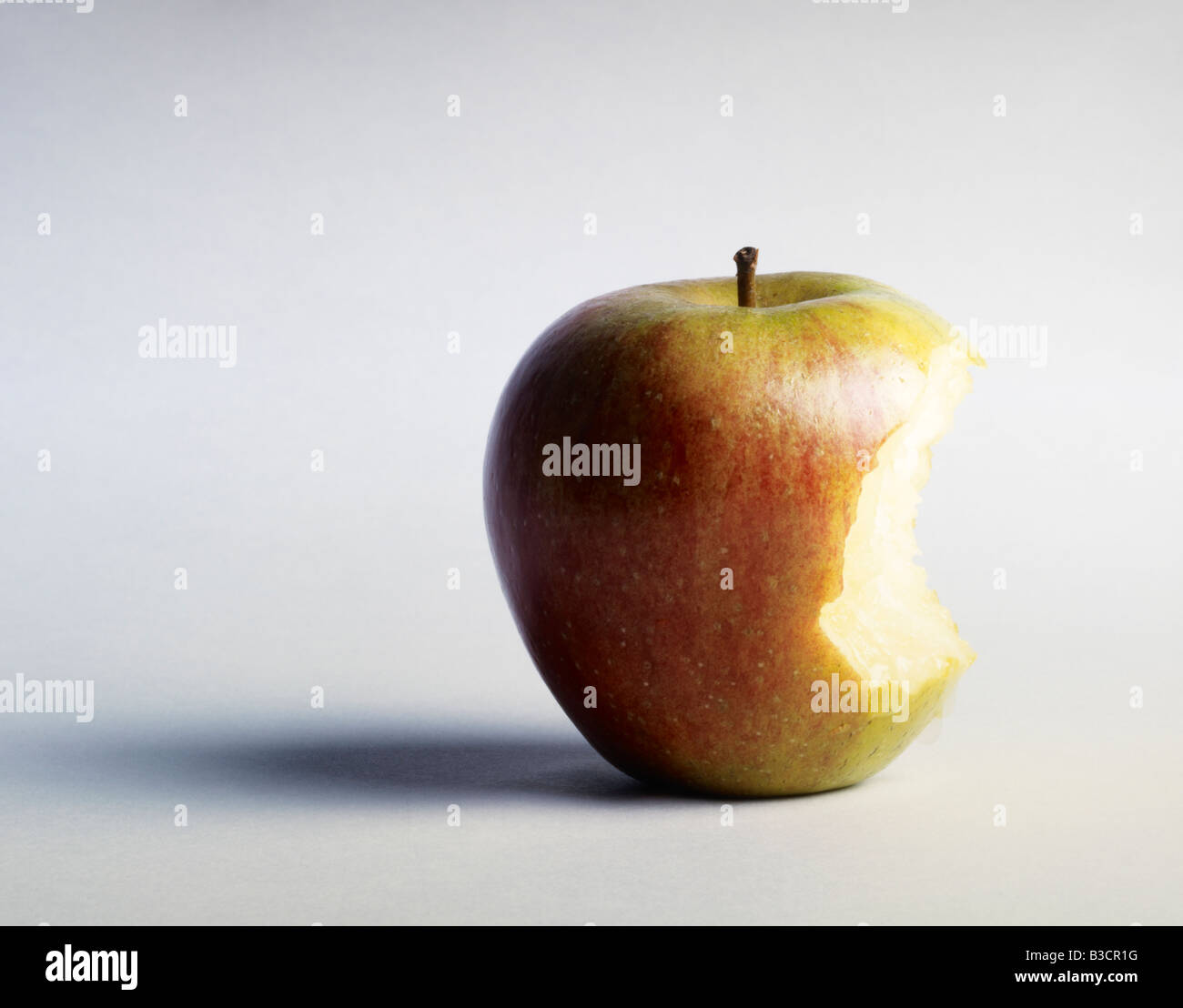 An apple with a bite taken out of it Stock Photo - Alamy