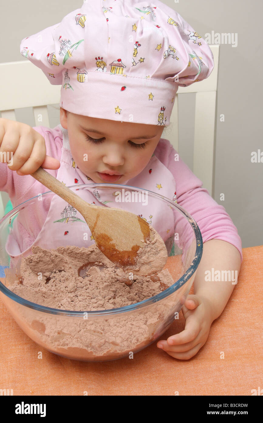 A small girl making cookies Stock Photo - Alamy