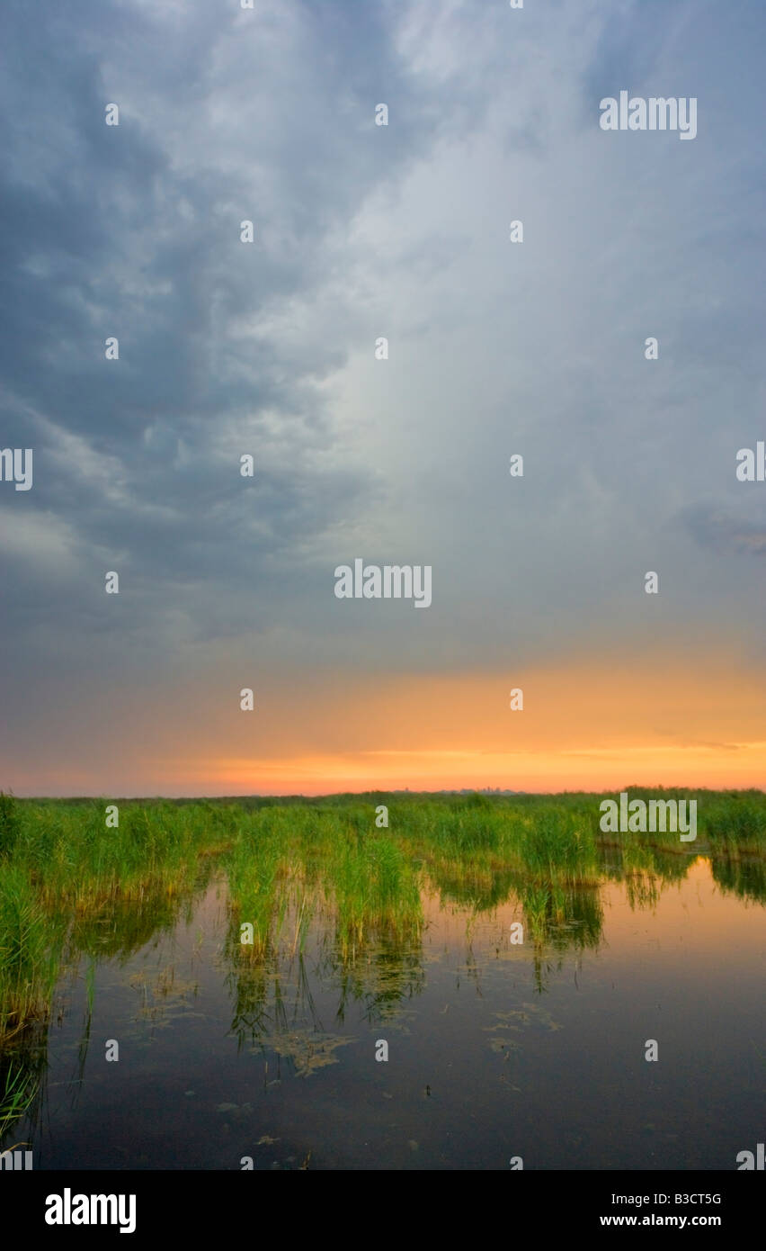 Sunrise over a lake Stock Photo - Alamy