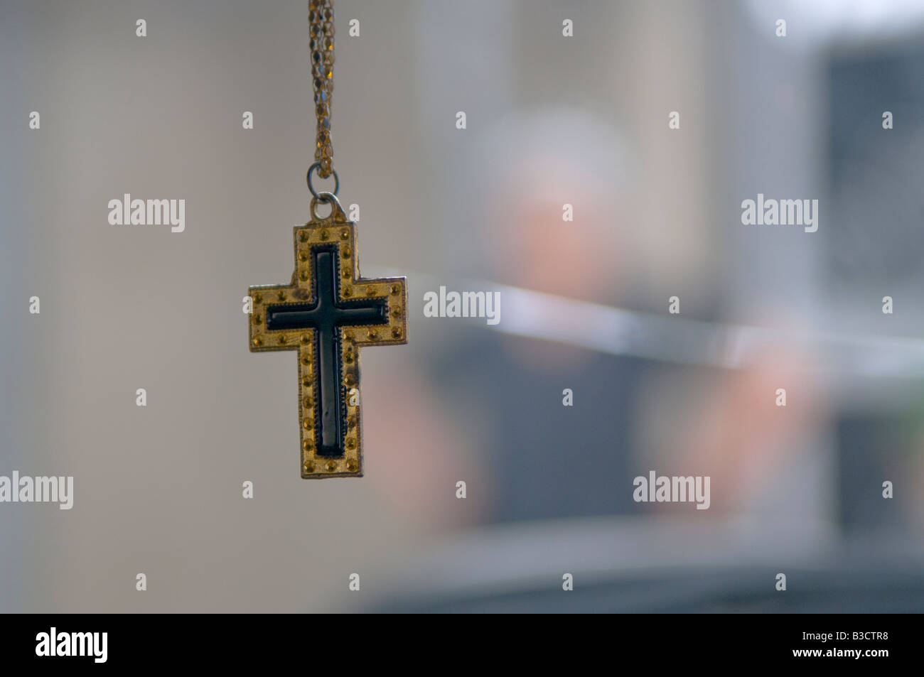 Crucifix hanging from a car front view mirror. Republic of Georgia ...