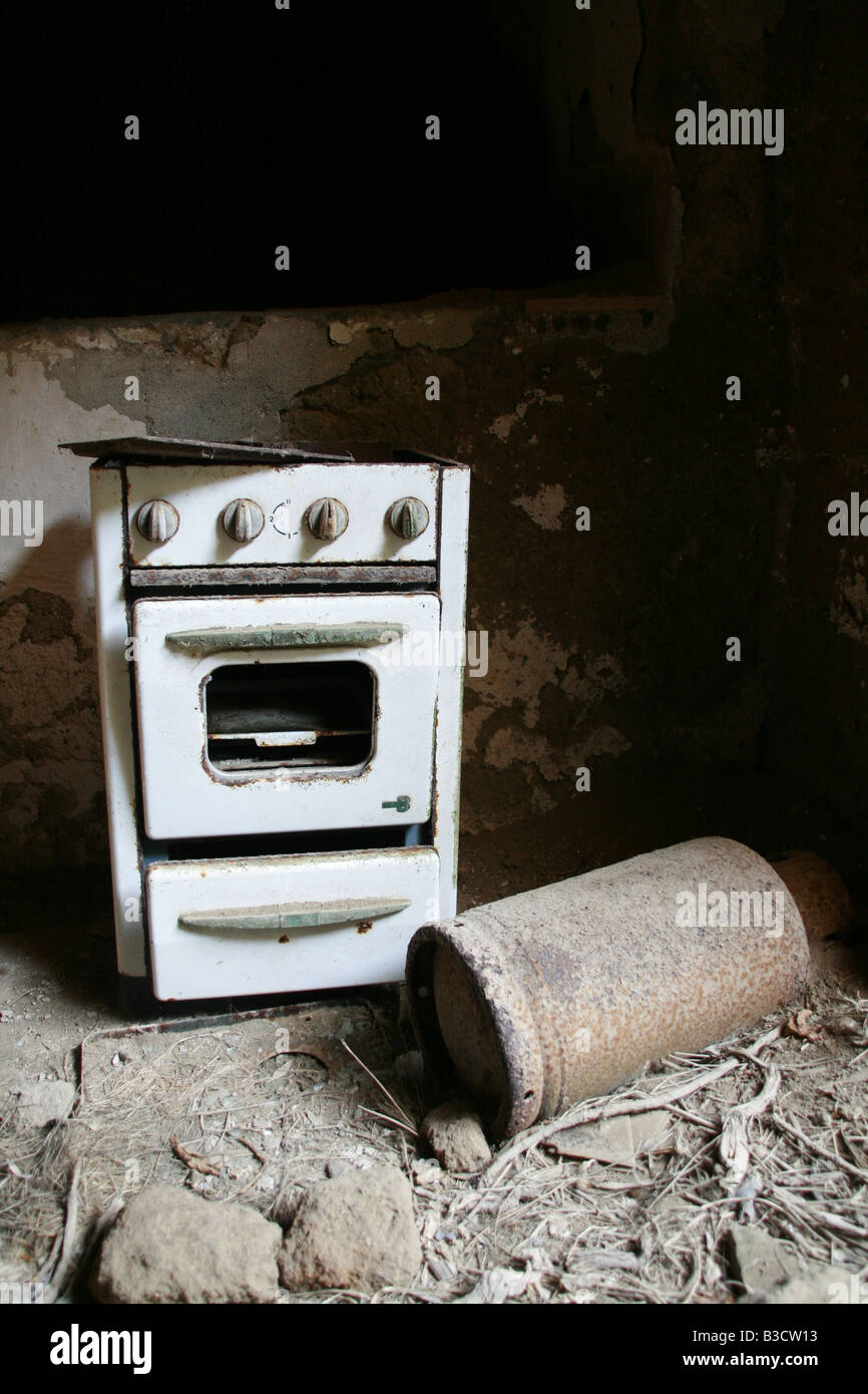 old damaged gas oven inside derelict building Stock Photo - Alamy