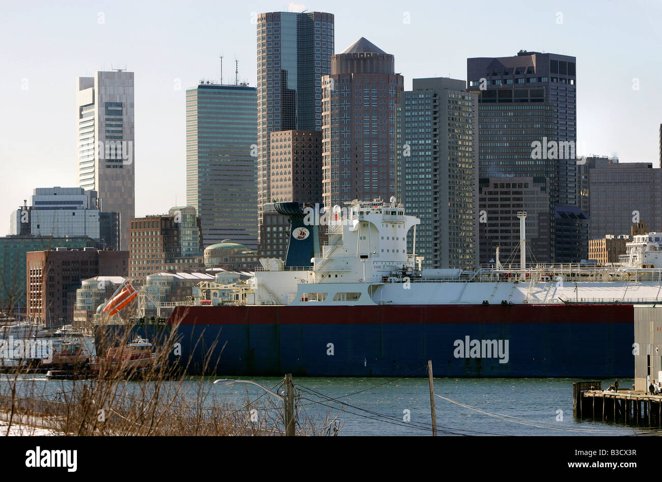 A liquefied natural gas tanker enters Boston Harbor past the city ...