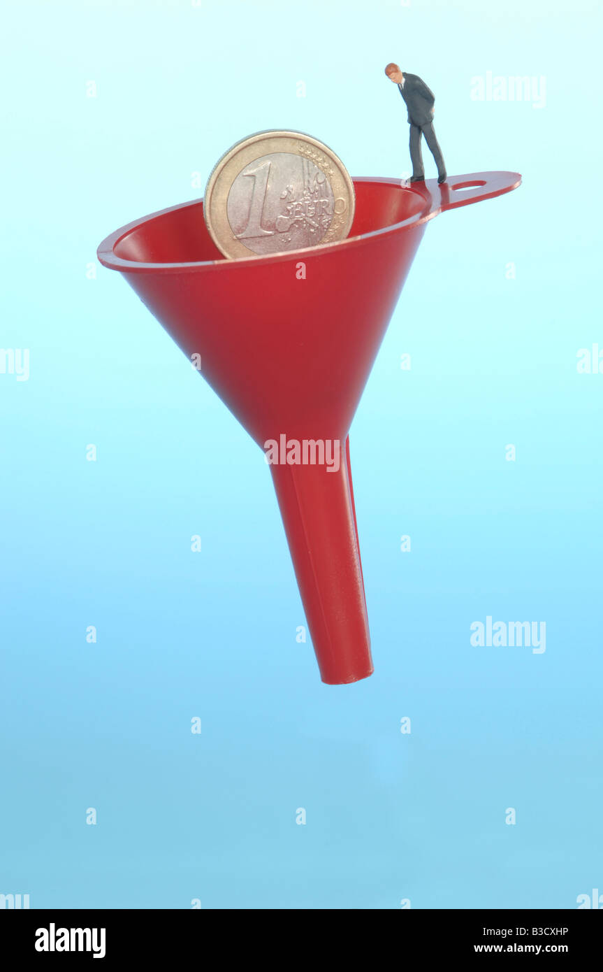 Business man figurine standing on funnel Stock Photo - Alamy