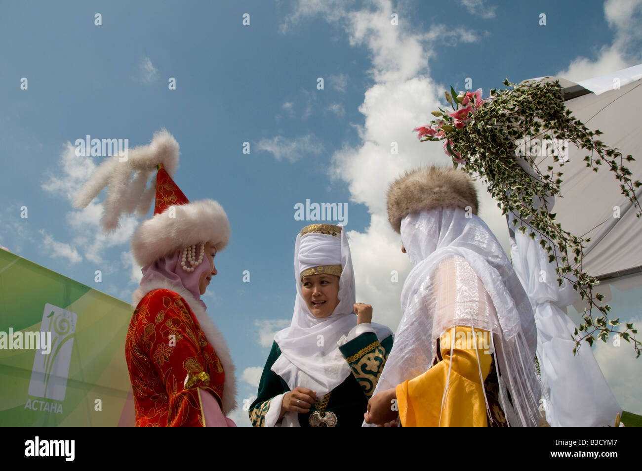 Kazakh women wearing traditional high headdress called Saukele for ...