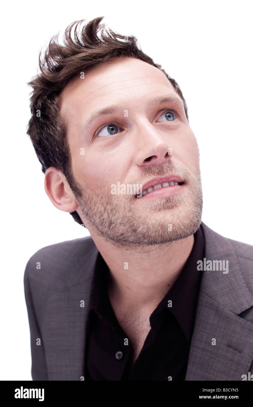 Young man looking up, portrait, close-up Stock Photo - Alamy