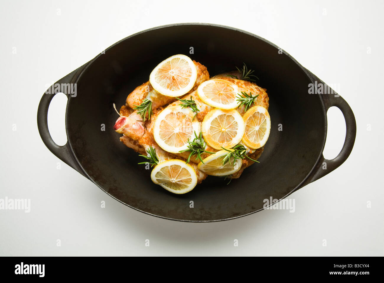 Row chicken in roasting tray, elevated view Stock Photo - Alamy