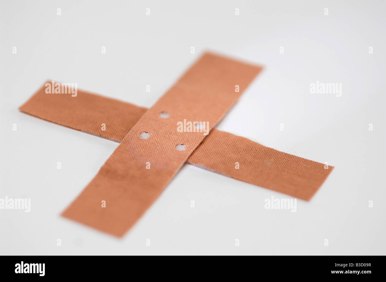 Crossed band-aids, close-up Stock Photo - Alamy