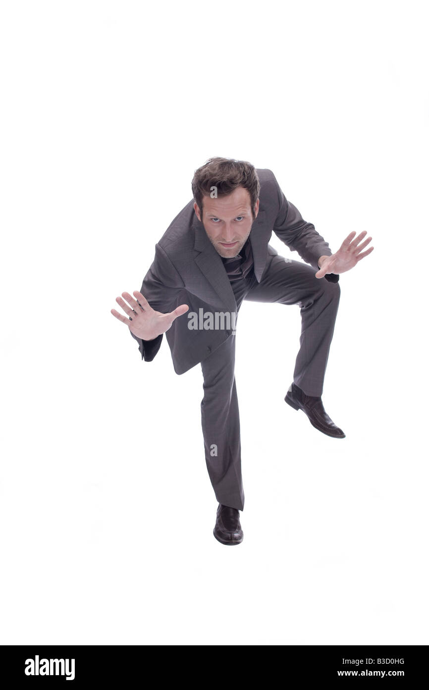 Man standing on one leg, portrait Stock Photo - Alamy