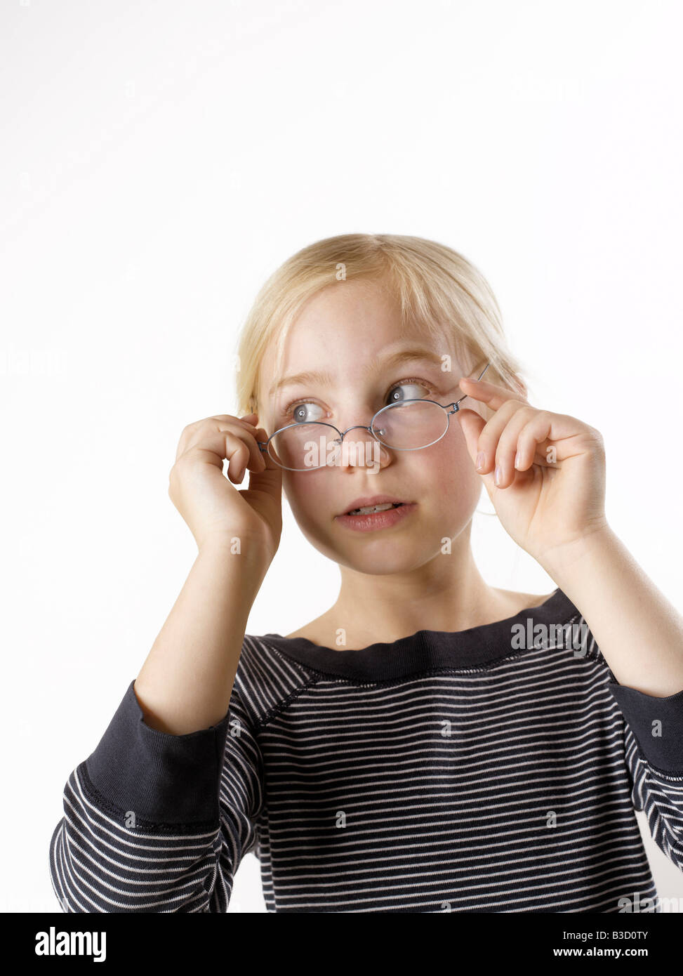 Girl (8-9) wearing spectacles, portrait Stock Photo - Alamy
