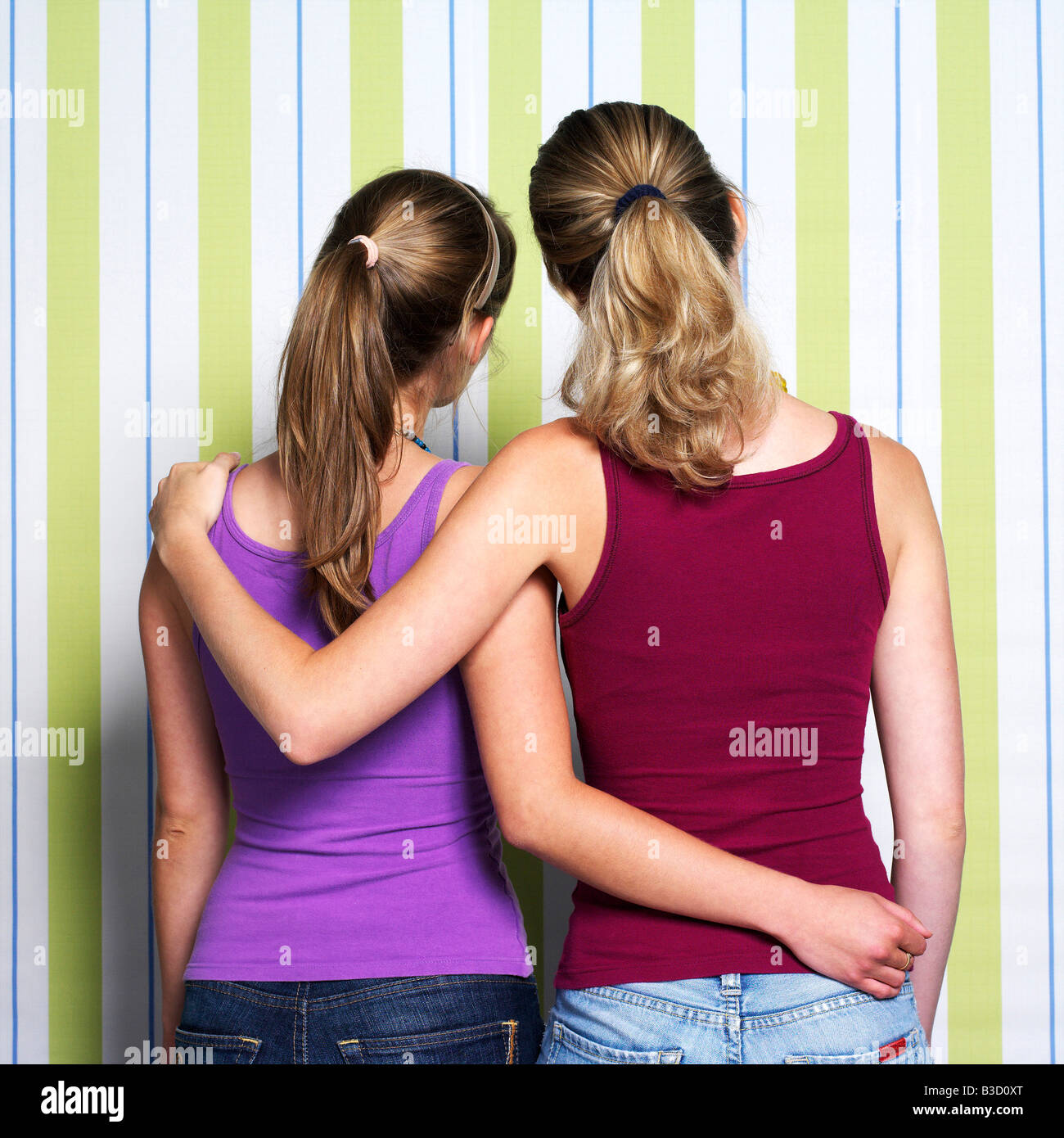 Two teenage girls (16-17) embracing, rear view Stock Photo - Alamy