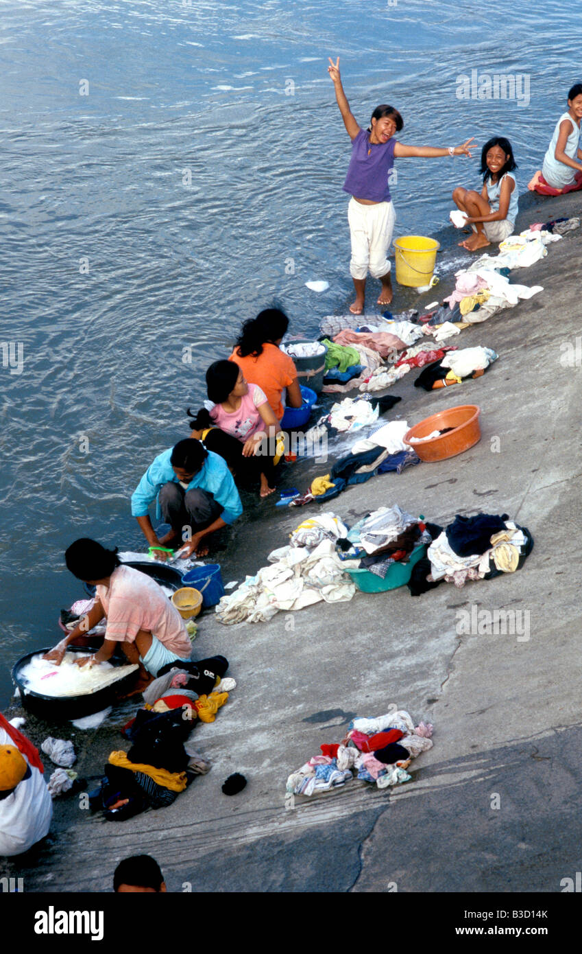 Philippines women doing washing clothes hi-res stock photography and ...
