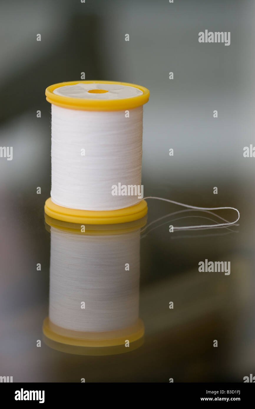 Reel of white cotton hi-res stock photography and images - Alamy