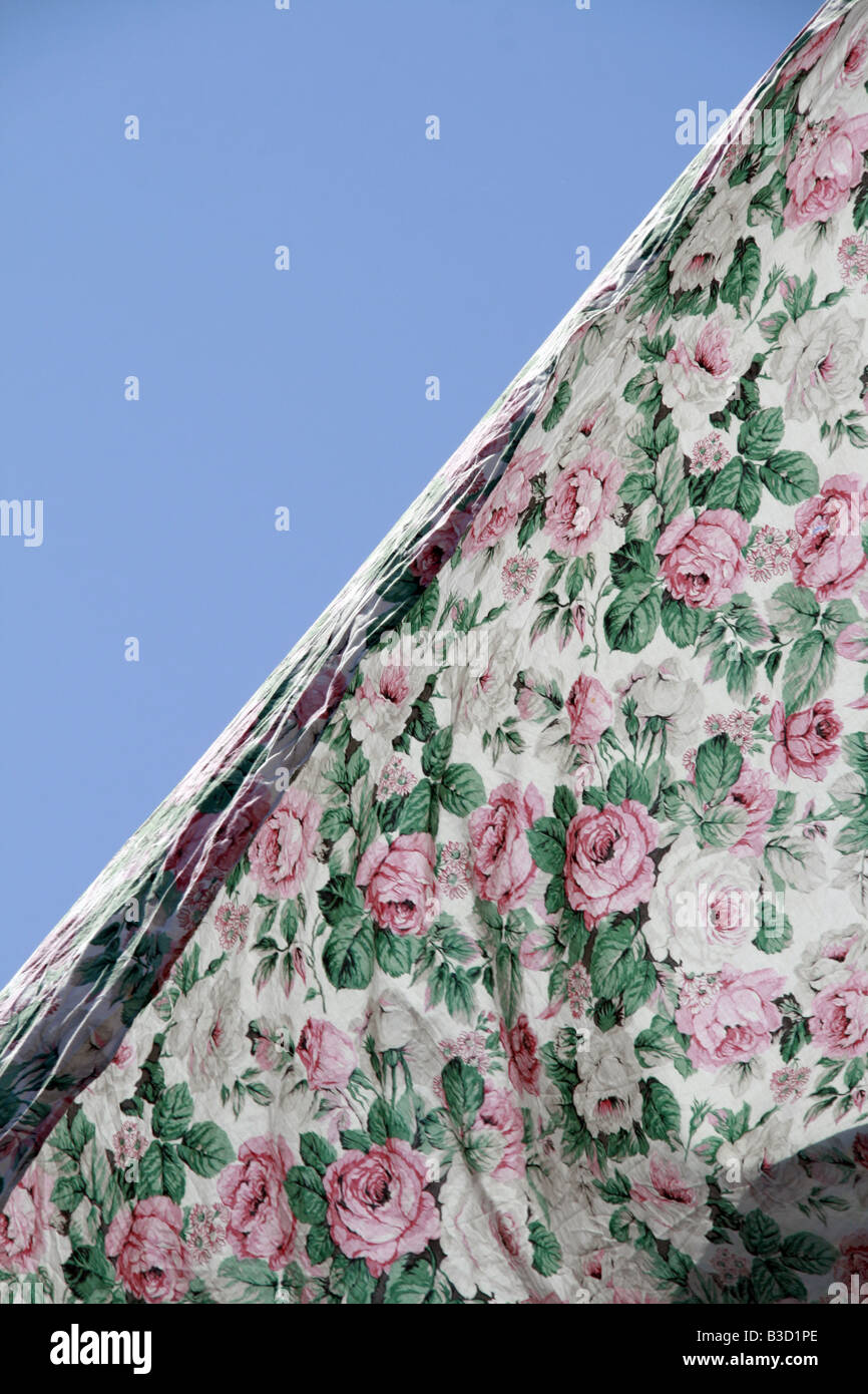 bedding flying in wind on washing line in sun Stock Photo - Alamy