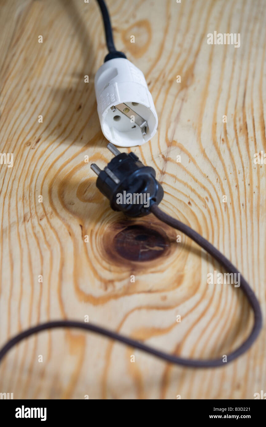 Socket and plug connector on wooden grain Stock Photo - Alamy