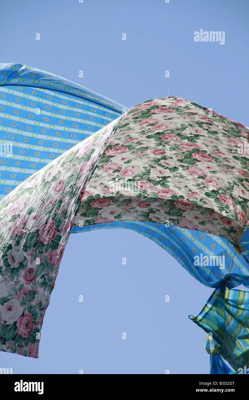 bedding flying in wind on washing line in sun Stock Photo - Alamy